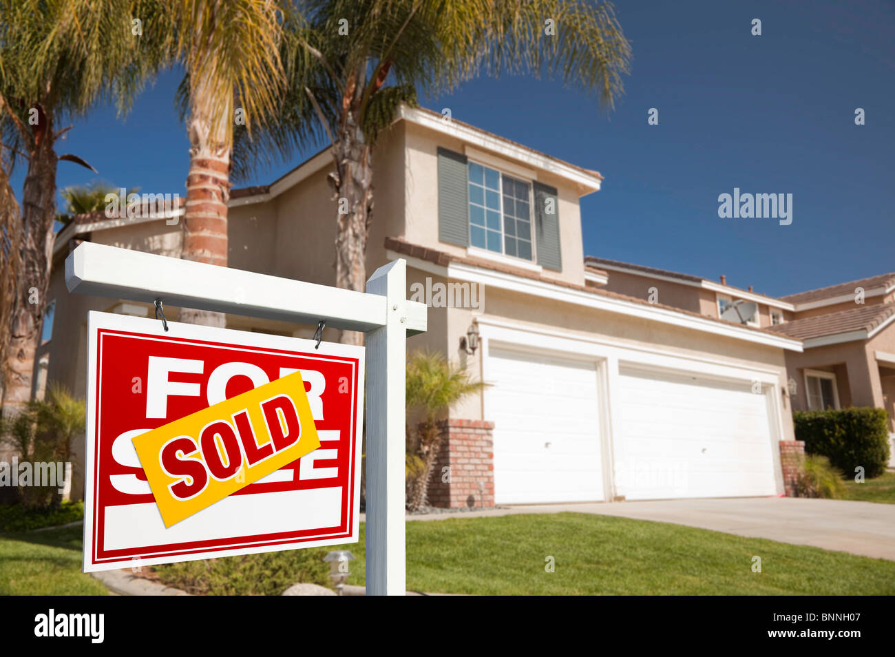 Red Sold For Sale Real Estate Sign in Front of House Stock Photo - Alamy