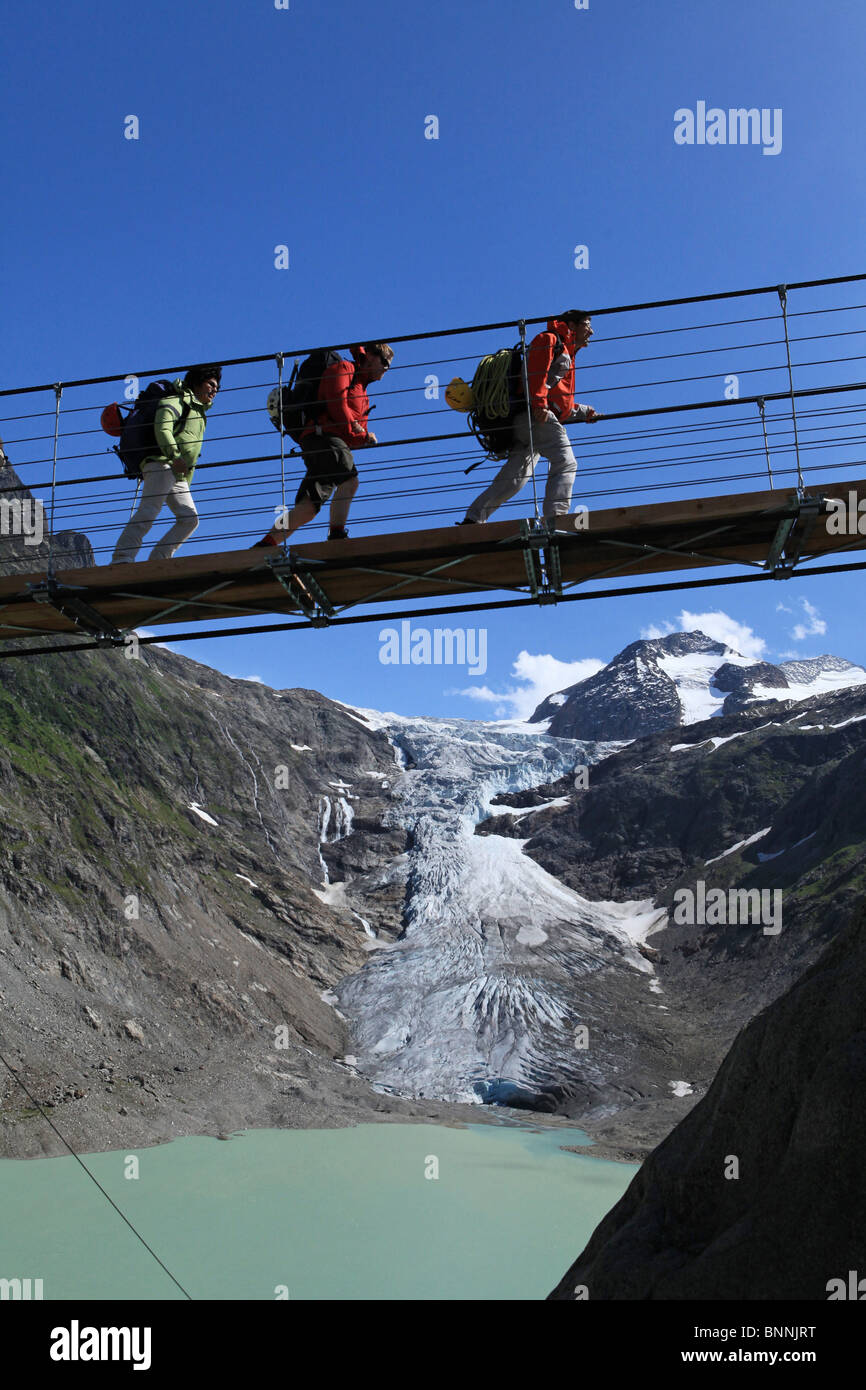 Switzerland swiss walk hike group three Trift glacier bridge glacier ...