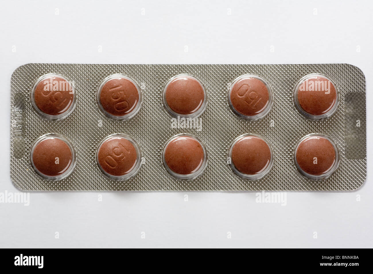 pack of brown pills isolated white background Stock Photo - Alamy