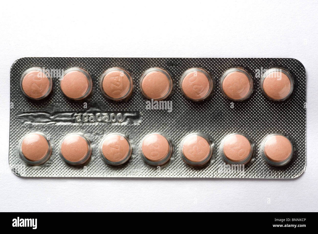 pack of pink pills isolated white background Stock Photo - Alamy