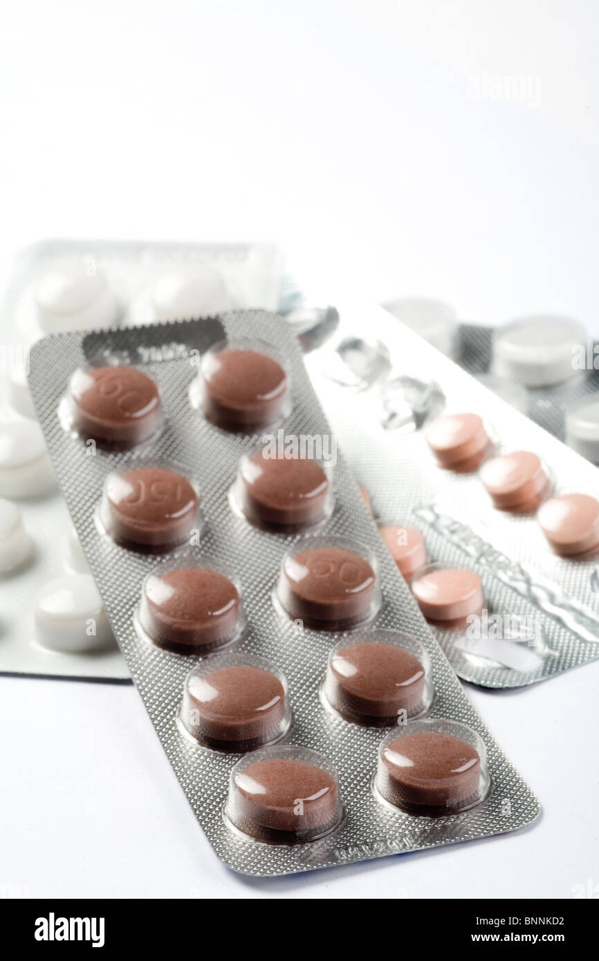 Lots of pills in their containers isolated on white background Stock ...