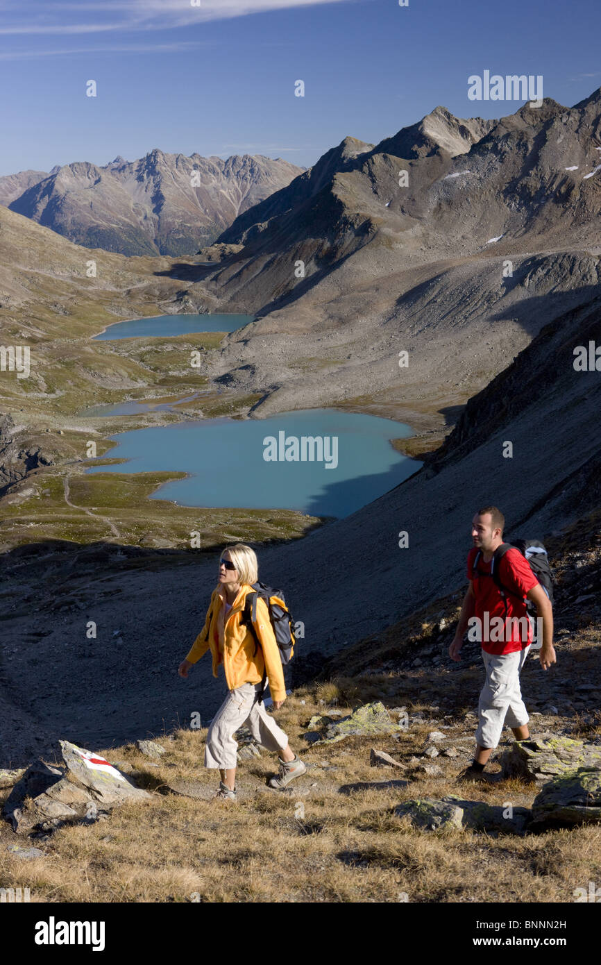 Switzerland swiss walk hike two pair couple scenery Jöriseen lakes ...