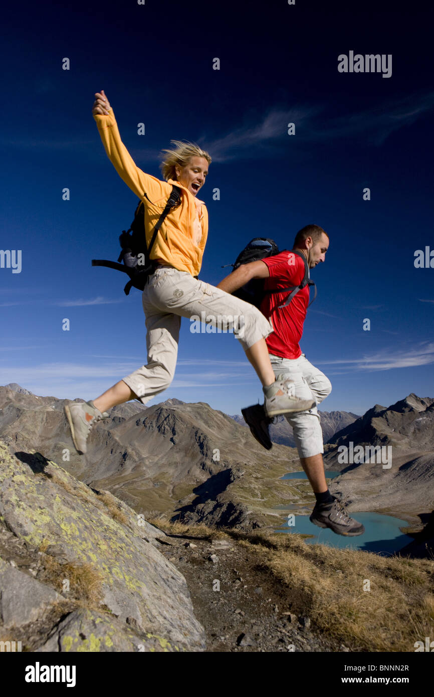 Switzerland swiss walk hike two pair couple jump dynamic scenery ...