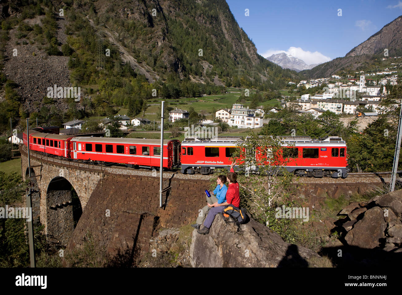Switzerland swiss walk hike pair couple seated sedentary break stop ...