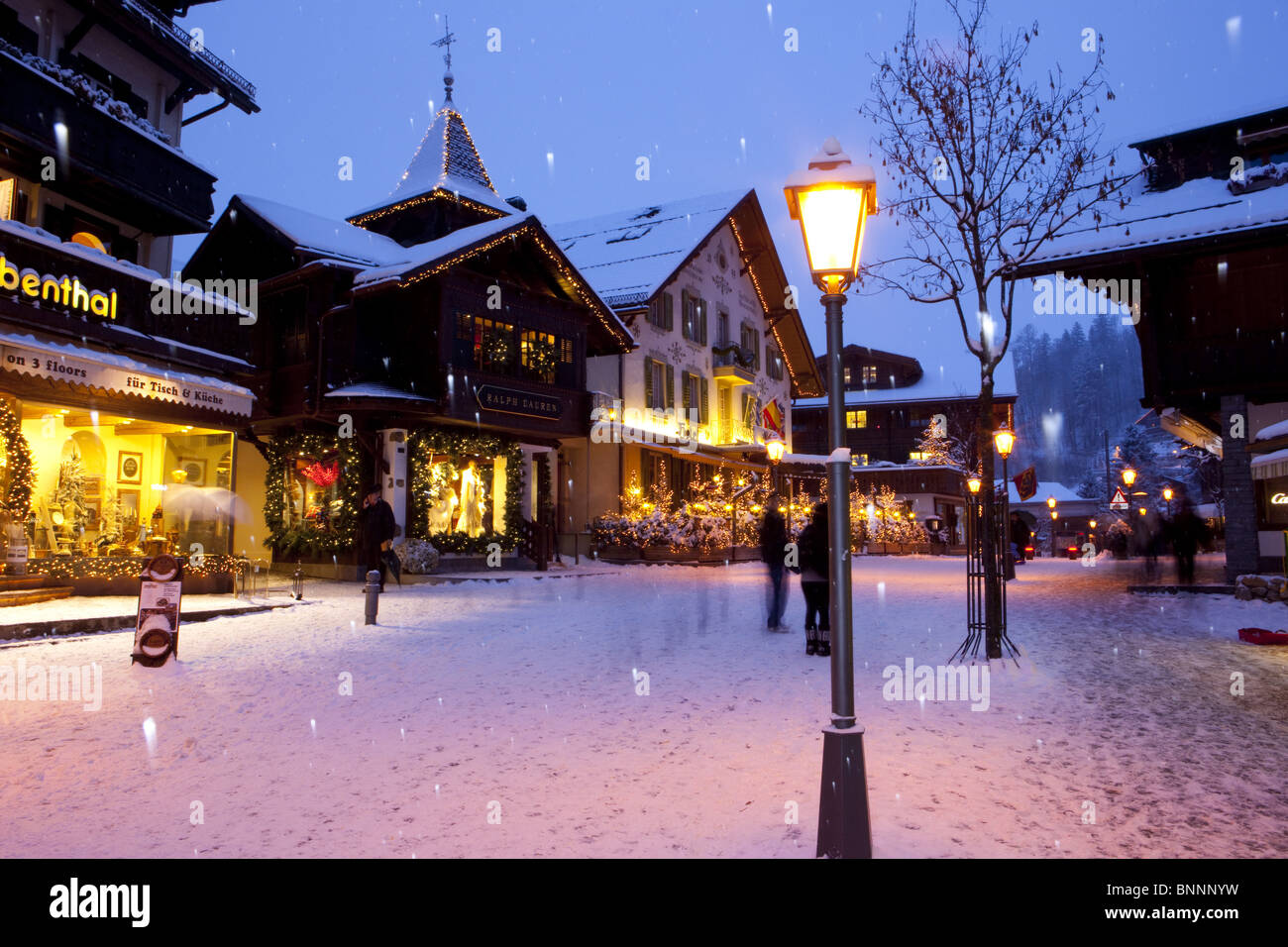 Gstaad BE Saanenland in evening village core street lantern lighting ...