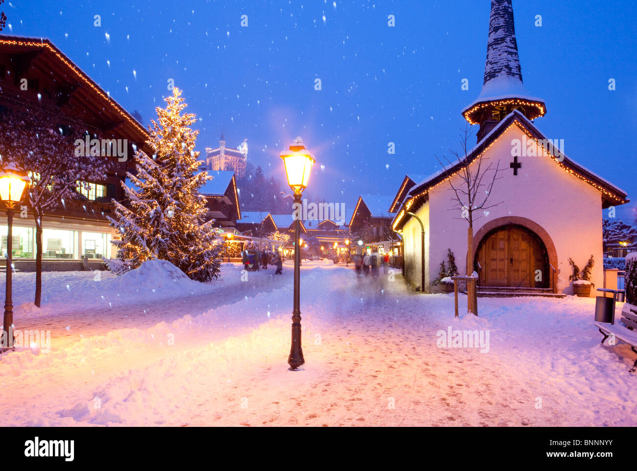 Gstaad BE Saanenland in evening village core street lantern lighting ...