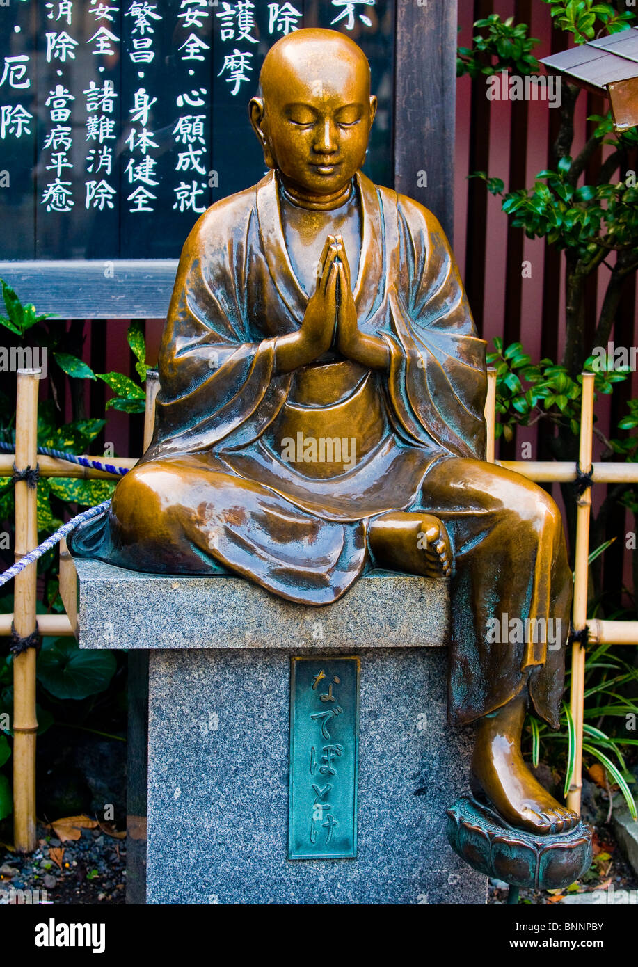 Statue in a Japanese shrine in Tokyo japan Stock Photo - Alamy