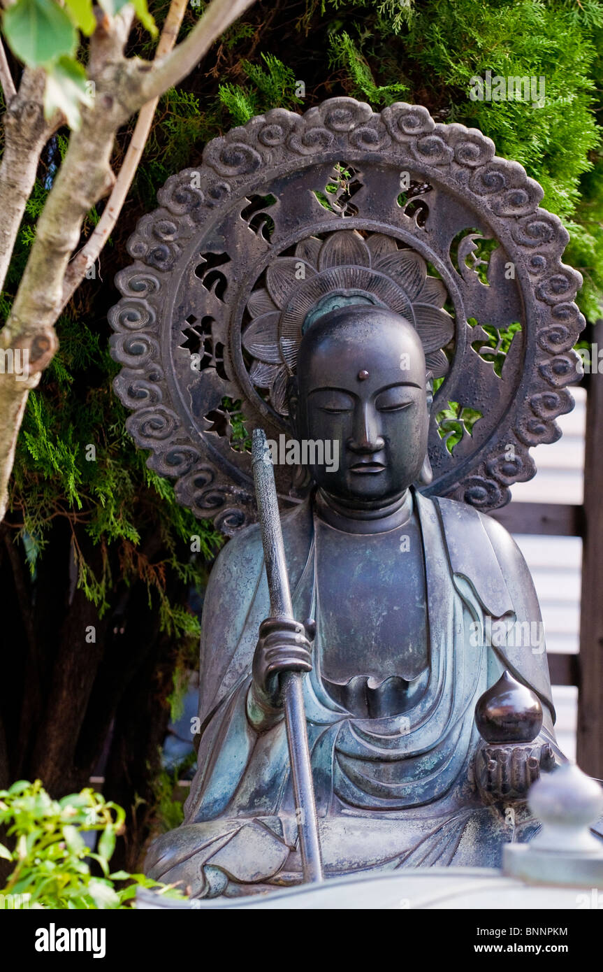Statue in a Japanese shrine in Tokyo japan Stock Photo - Alamy