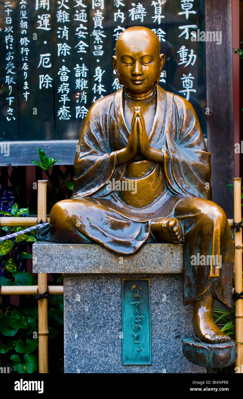 Statue in a Japanese shrine in Tokyo japan Stock Photo - Alamy