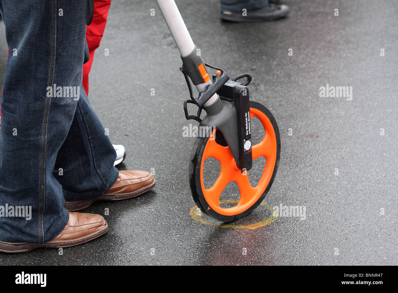 Road measuring wheel Stock Photo - Alamy