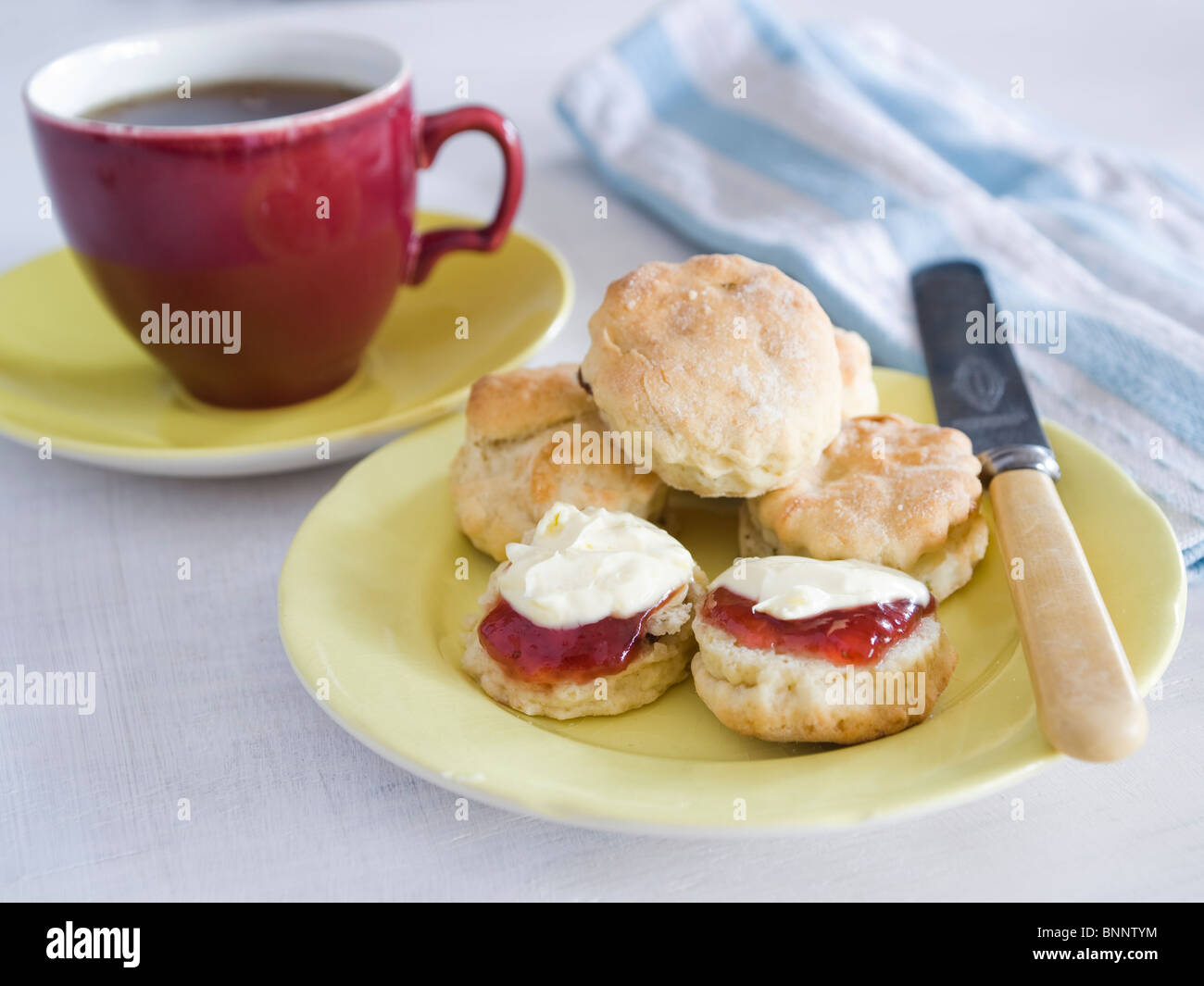 Still life of scones with clotted cream and jam Stock Photo - Alamy