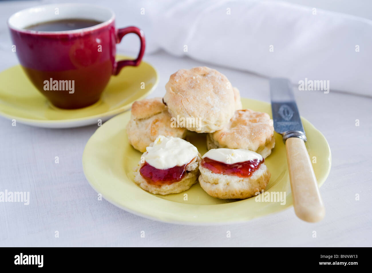 Still life of scones with clotted cream and jam Stock Photo - Alamy