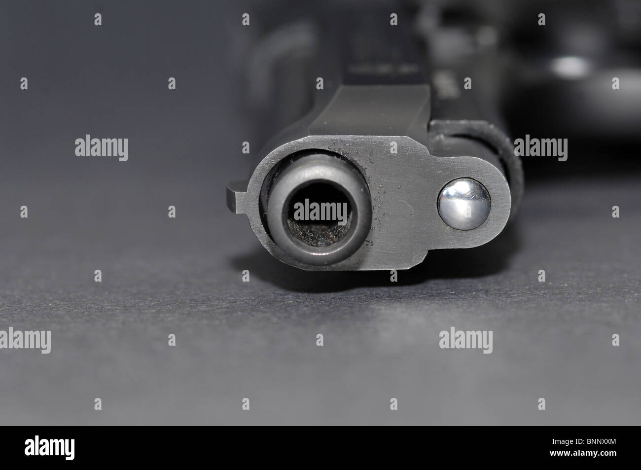 Taurus PT-92 9mm handgun detail of the barrel and showing some of the ...