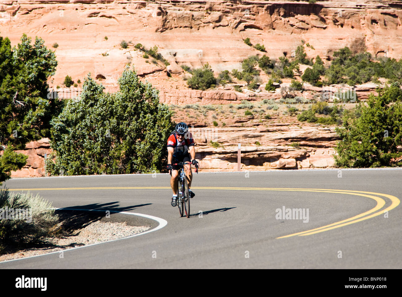 A biker rides on the scenic Rim Rock Drive in Colorado National ...