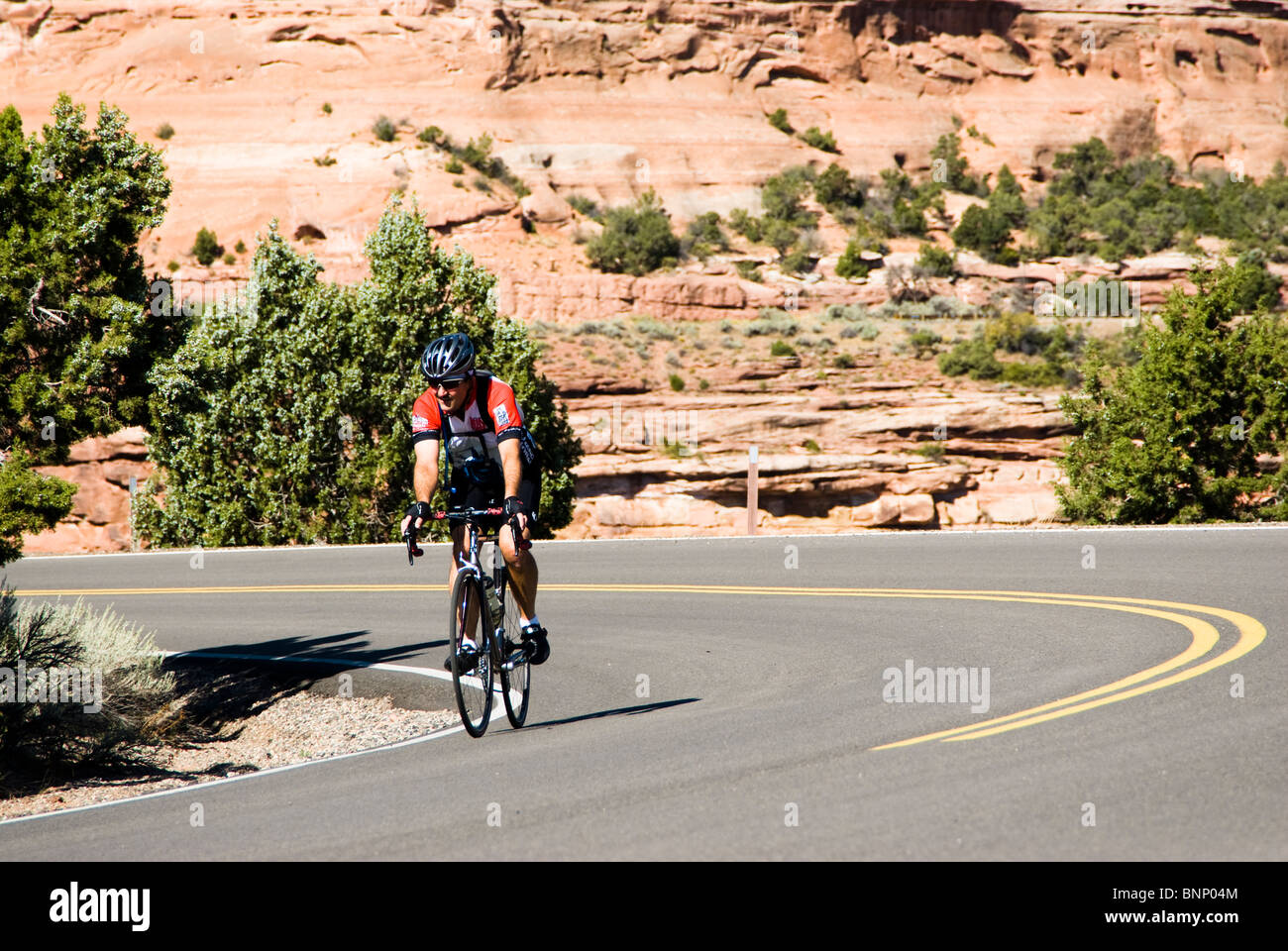 A biker rides on the scenic Rim Rock Drive in Colorado National ...