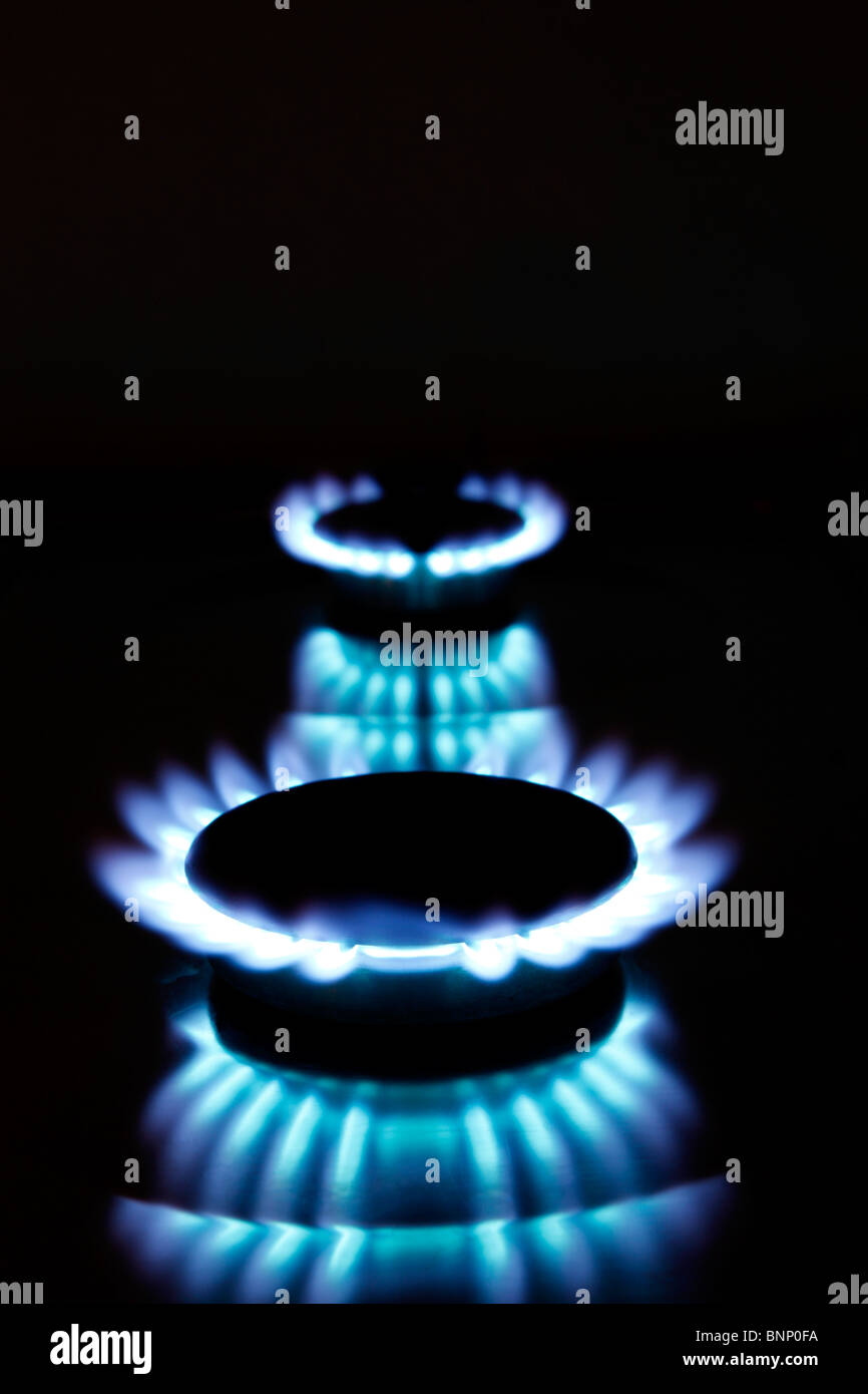 Beautiful kitchen blue gas flames burning, with dark background. Great ...