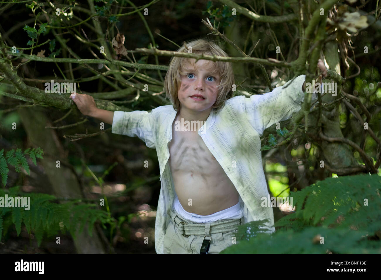 A boy with a wild untamed appearance Stock Photo - Alamy