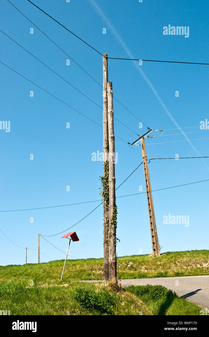 Wood telephone and concrete electricity posts spoiling countryside ...