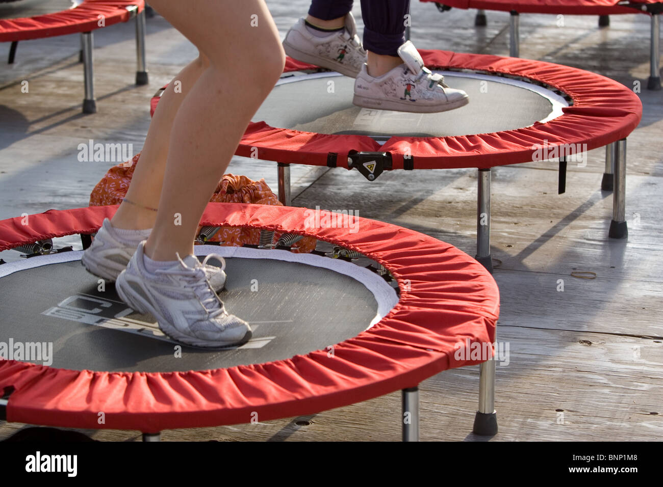 group of people at aerobics gym fitness class. legs jump jumping ...