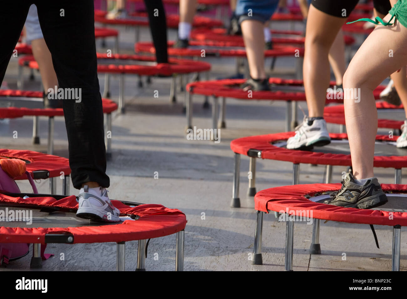 group of people at aerobics gym fitness class. legs jump jumping ...