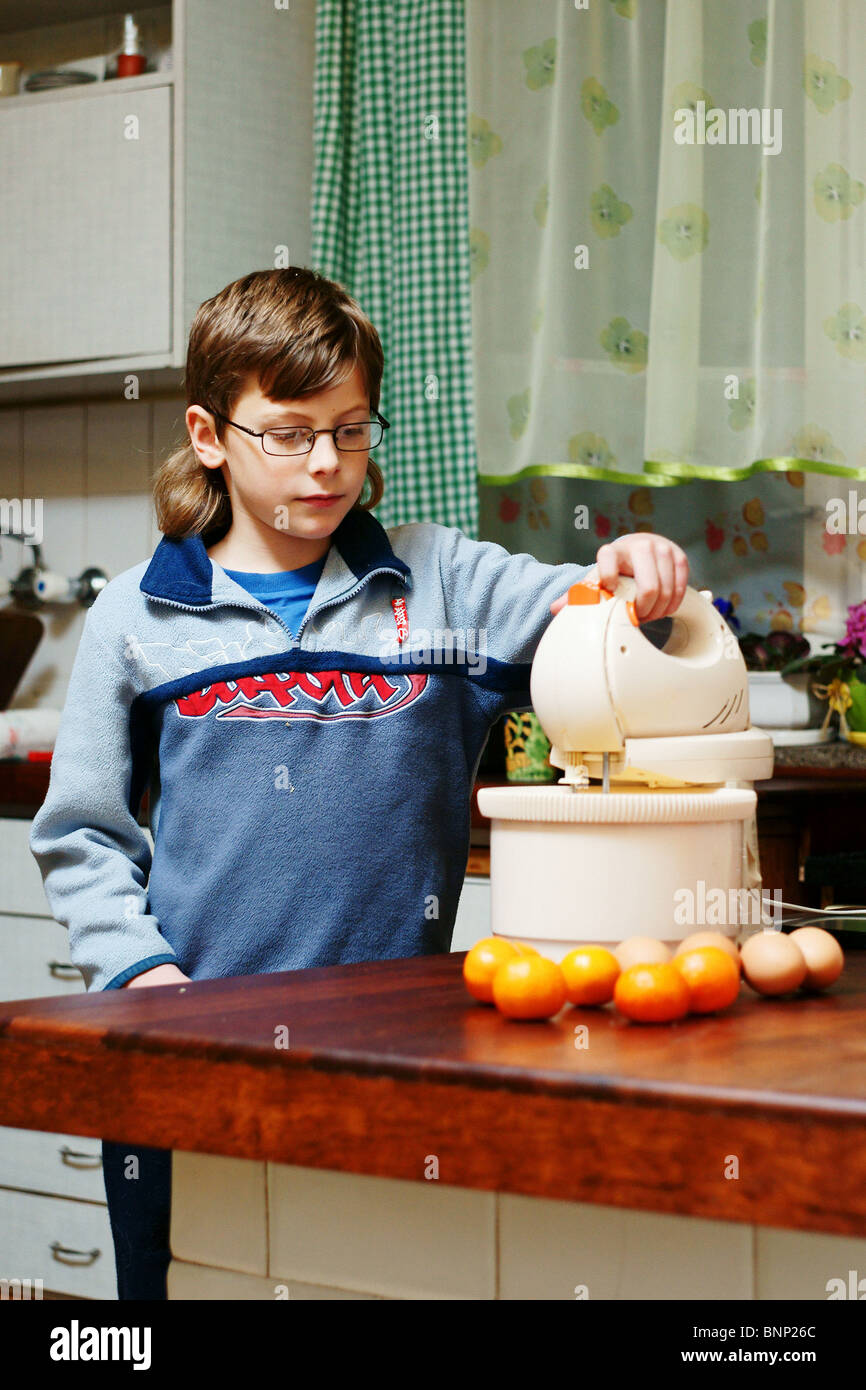Young boy baking cakes Stock Photo - Alamy