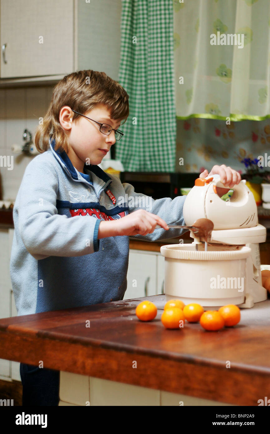 Young boy baking cakes Stock Photo - Alamy