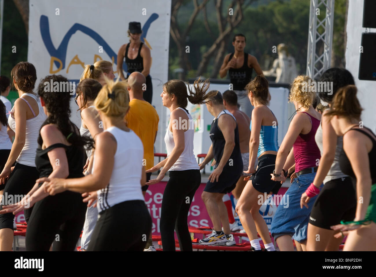 group of people at aerobics gym fitness class. legs jump jumping ...