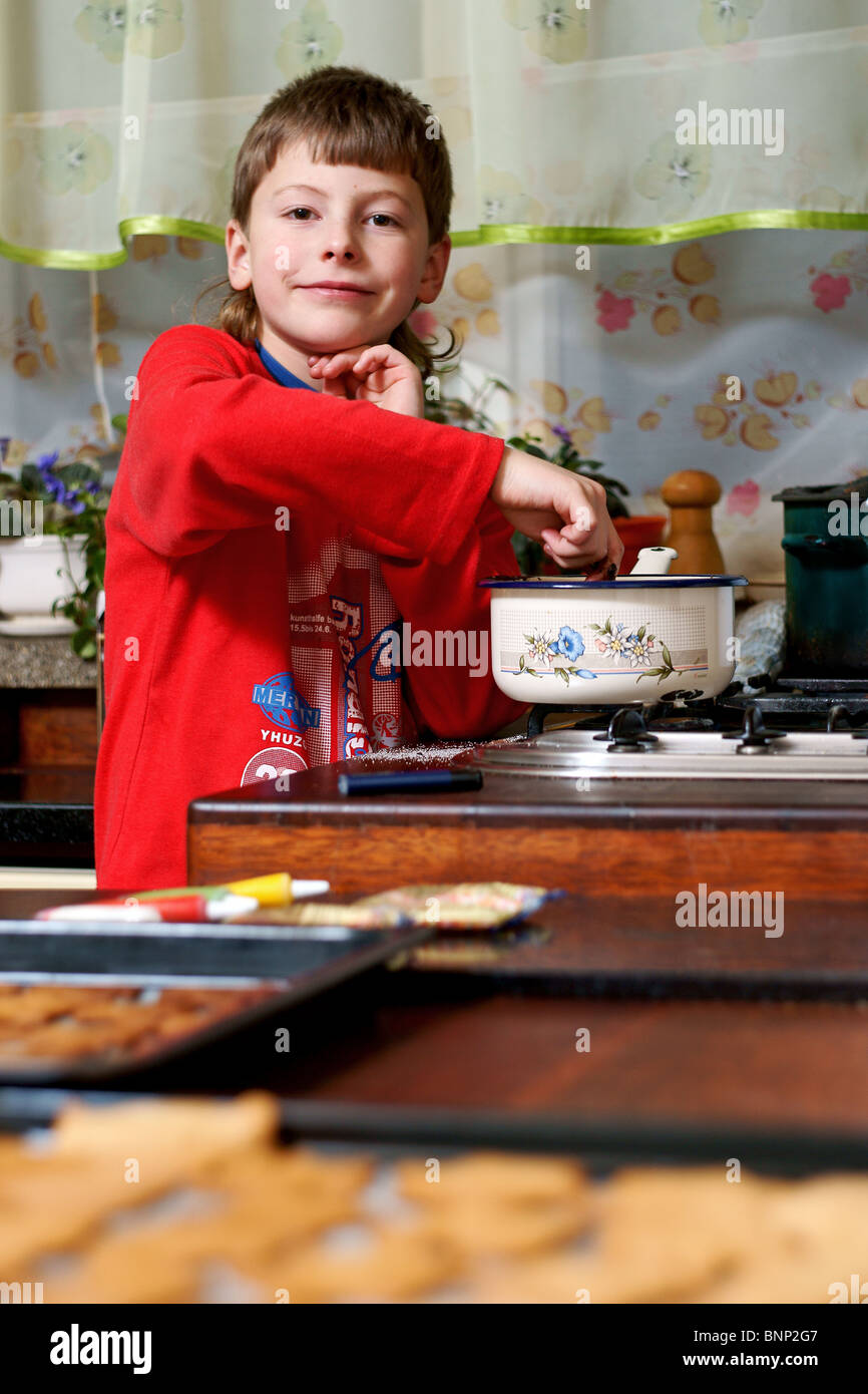Young boy baking cakes Stock Photo - Alamy