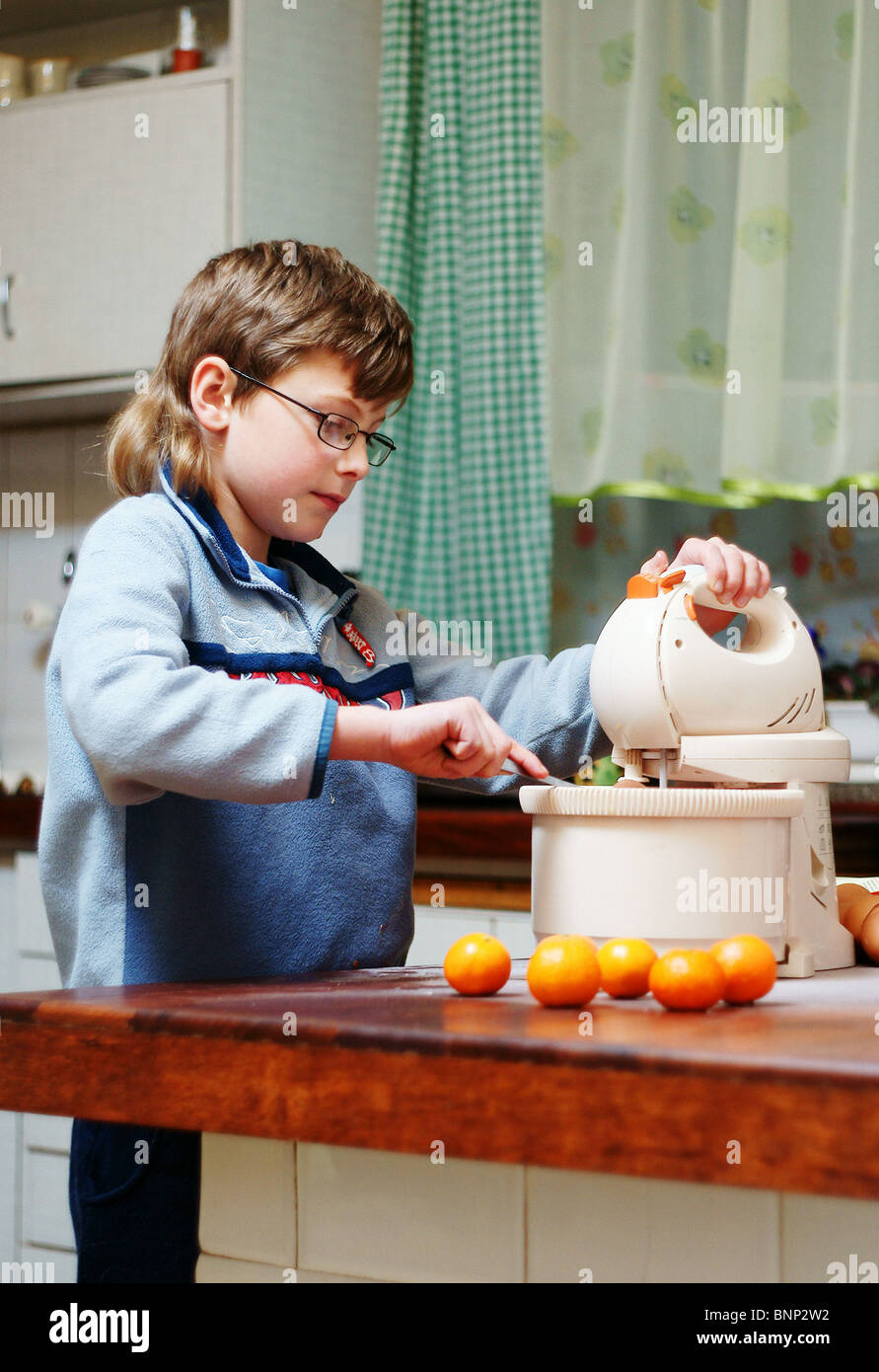 Young boy baking cakes Stock Photo - Alamy