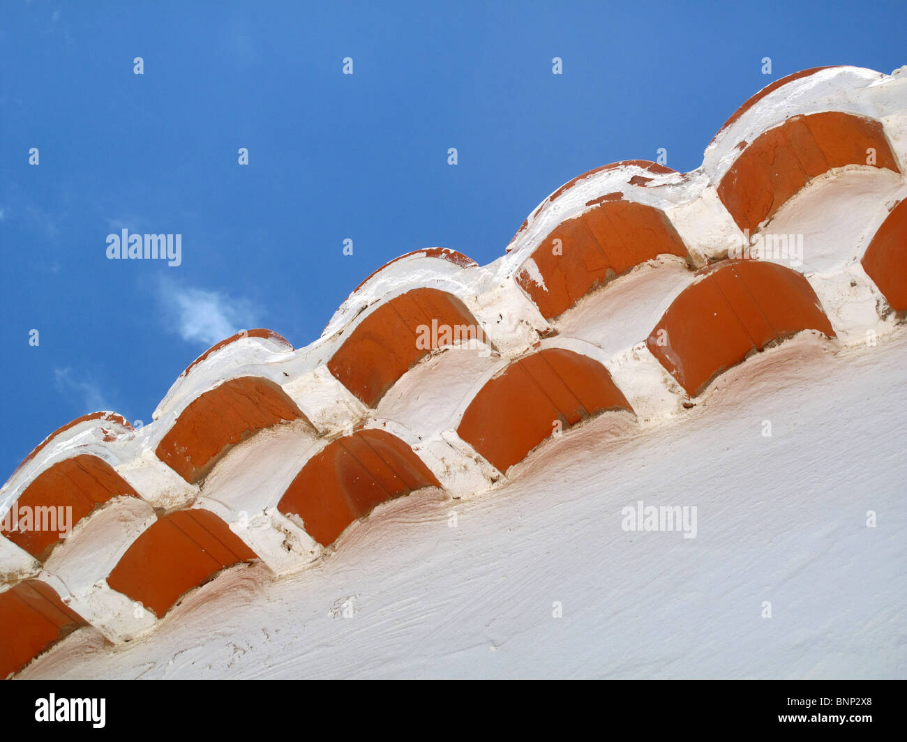 Clay pantile roof edge detail with blue sky Stock Photo - Alamy