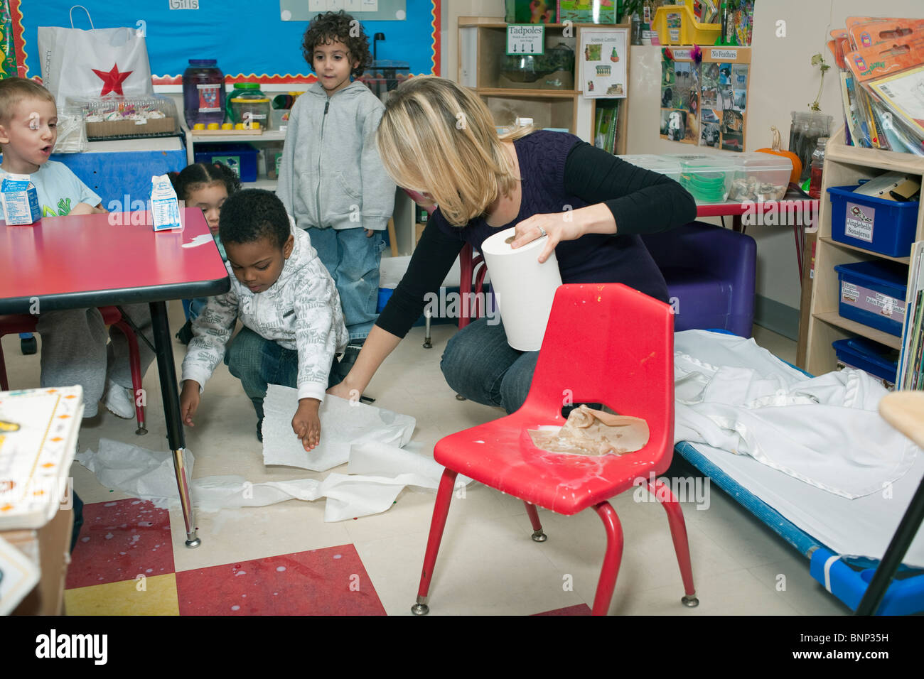 Preschool Classroom spilling milk on the floor Stock Photo - Alamy