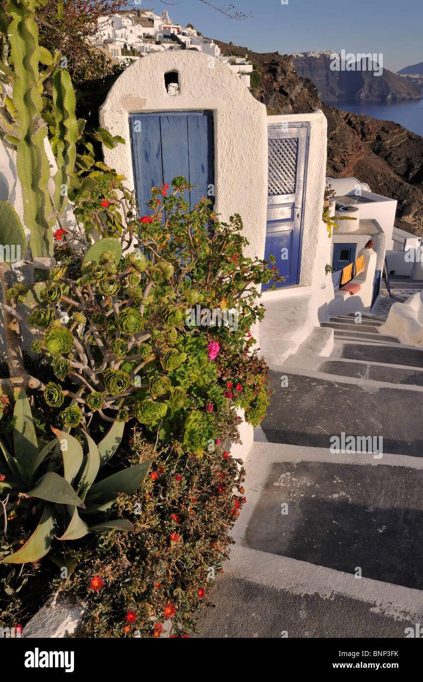 A walkway and stairs leading to a typical cliff dwelling on the caldera ...