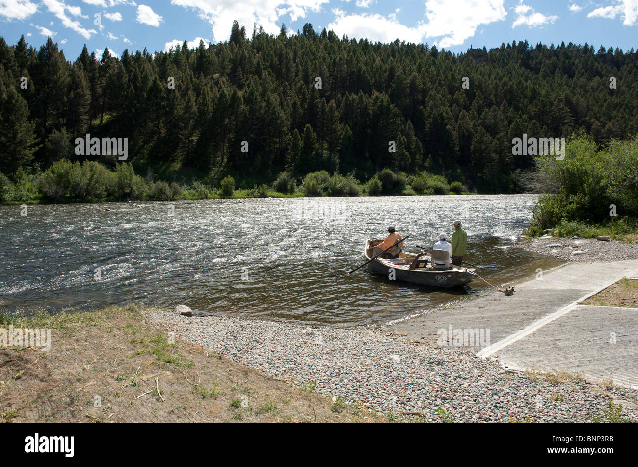 Fishermen and their float boat waiting on the launch ramp, Madison ...