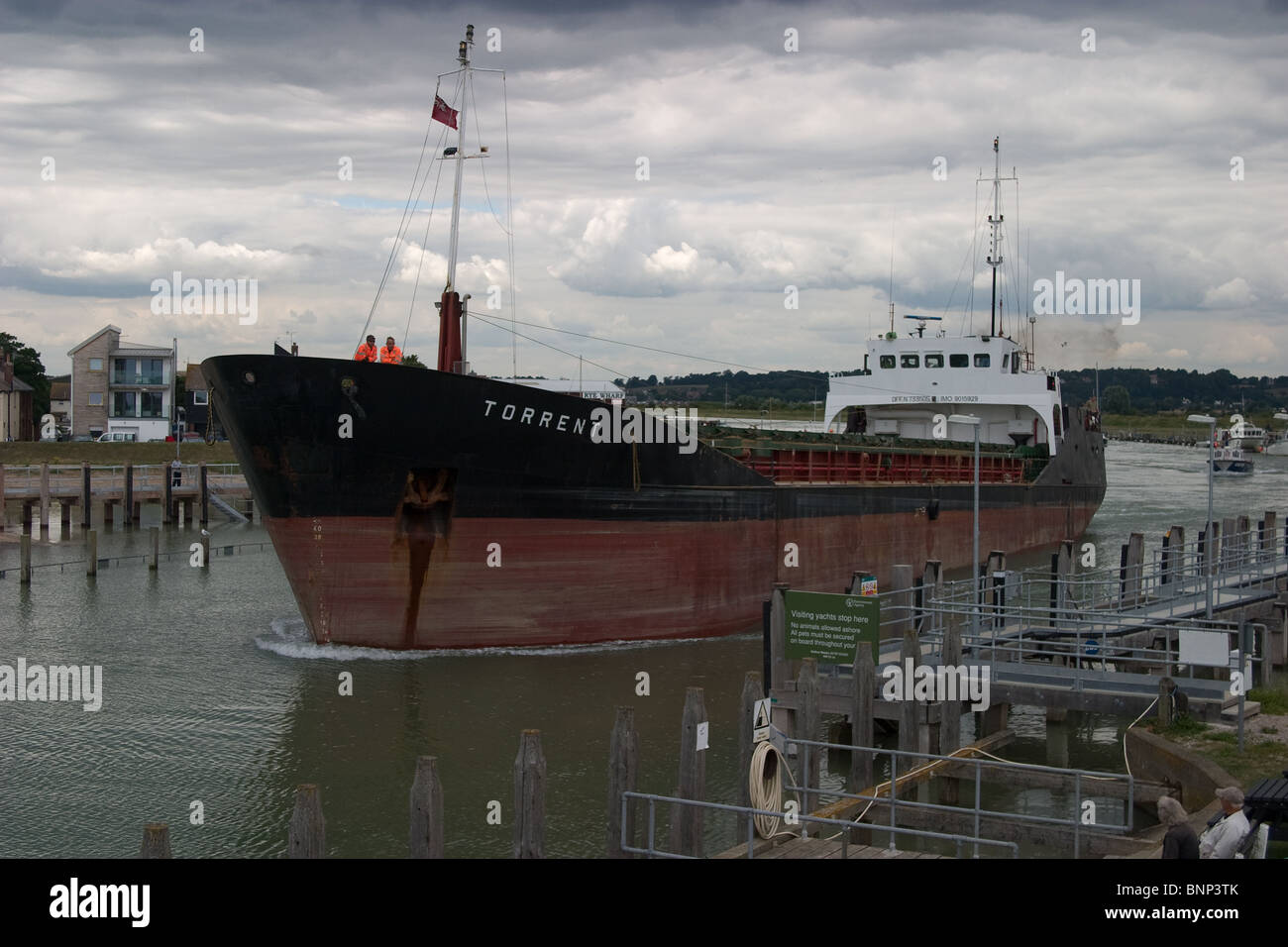 small cargo boat tanker river channel cloudy sky Stock Photo - Alamy