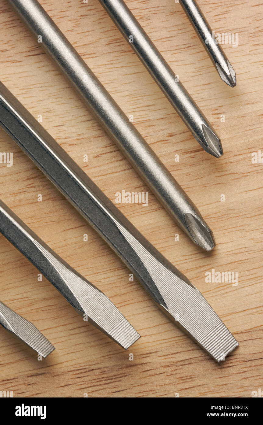 Series of Screwdrivers on a Wood Background Stock Photo - Alamy