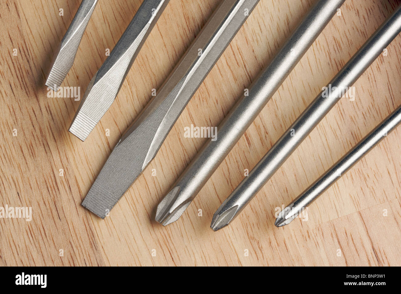 Series of Screwdrivers on a Wood Background Stock Photo - Alamy