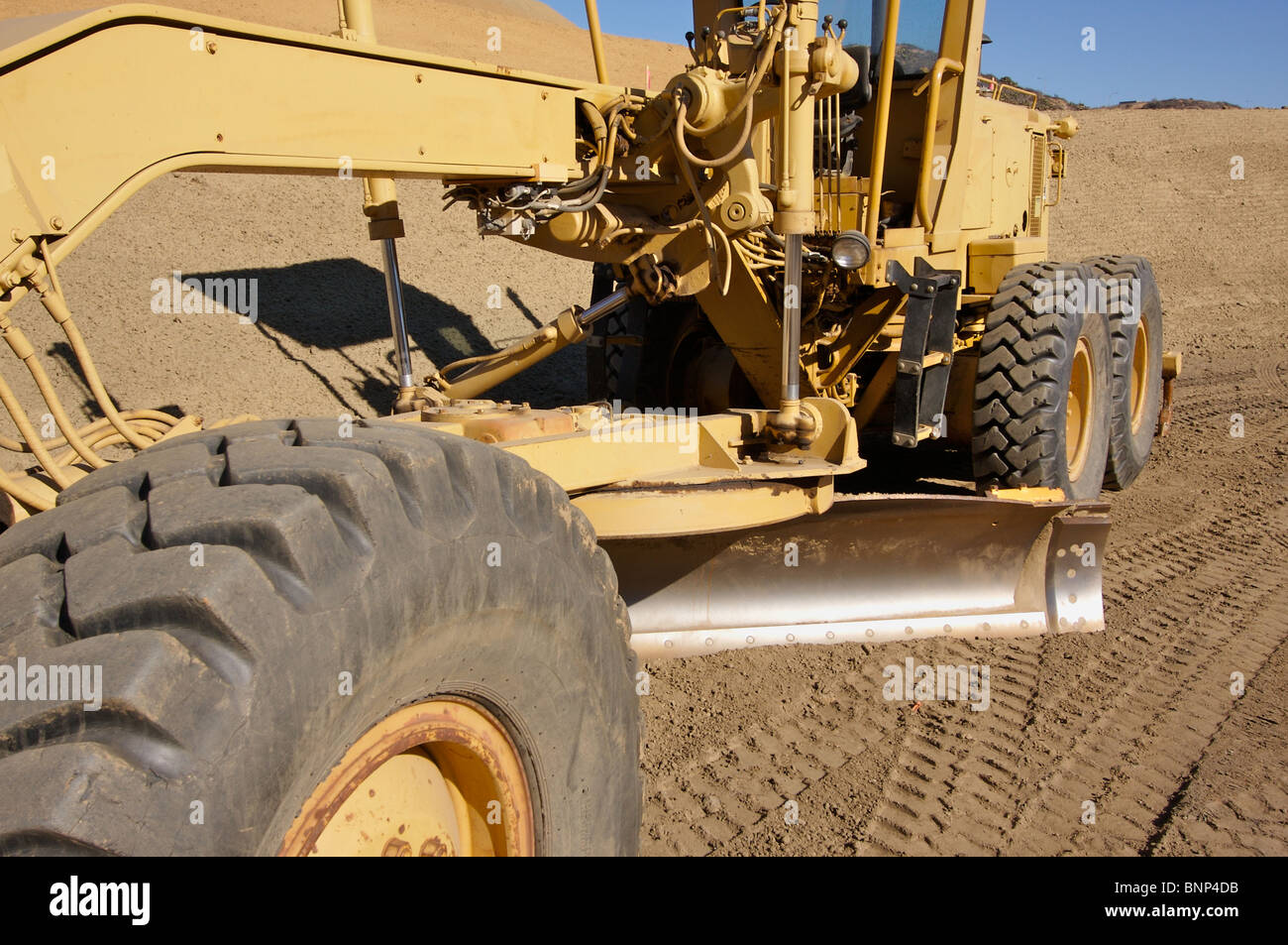 Tractor at a Construction Site on a dirt lot Stock Photo - Alamy