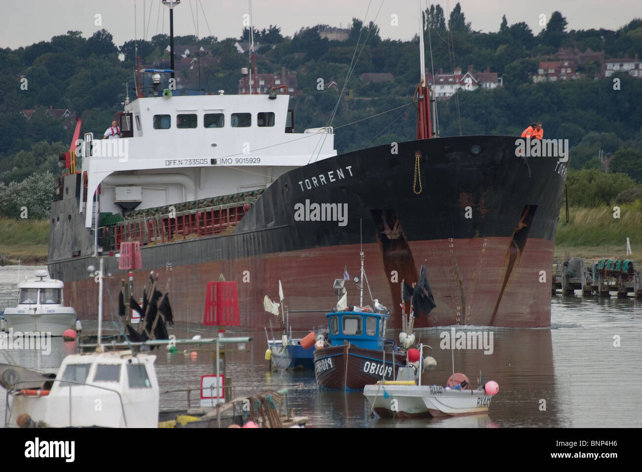 small cargo boat tanker river channel cloudy sky Stock Photo - Alamy