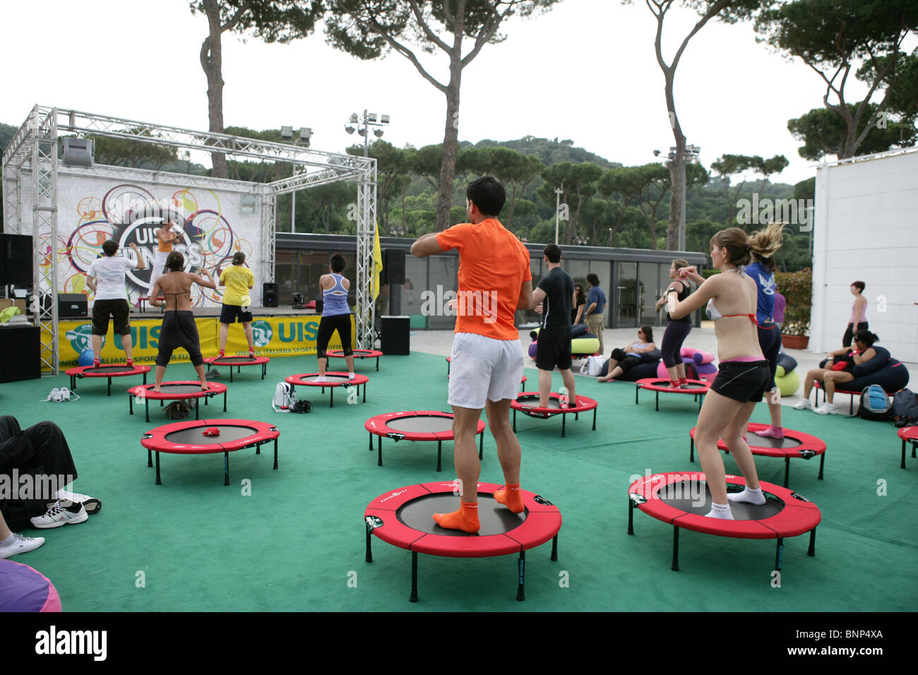 group of people at aerobics gym fitness class. legs jump jumping ...