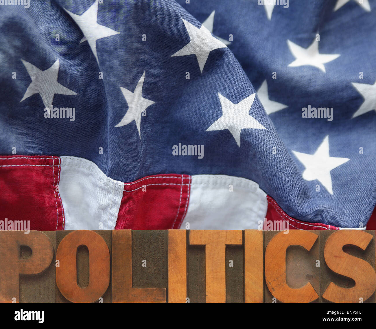 American flag with politics word in wood type Stock Photo - Alamy