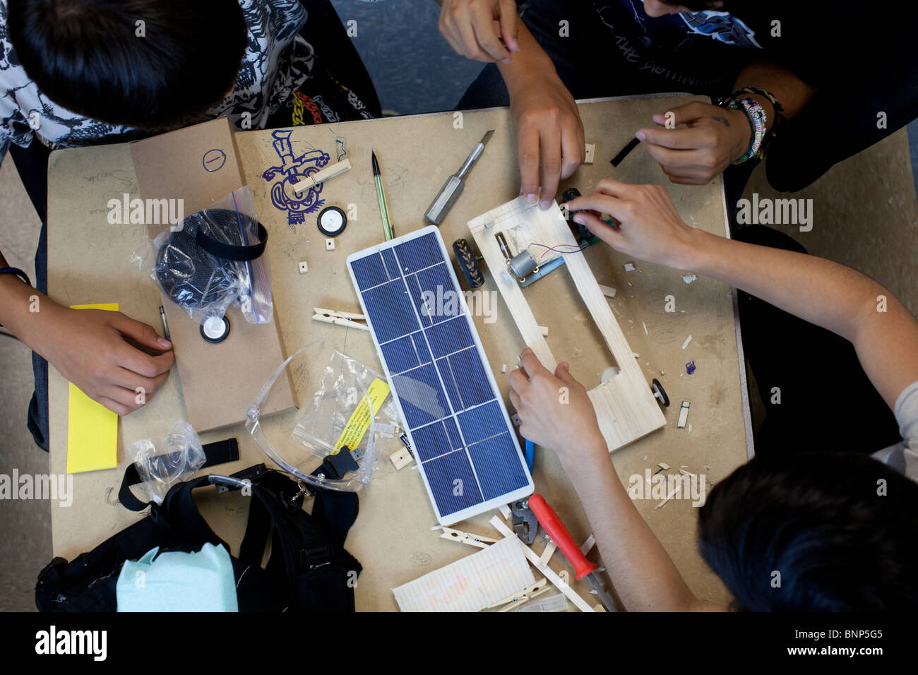 Students work on radio-controlled model solar cars in engineering class ...