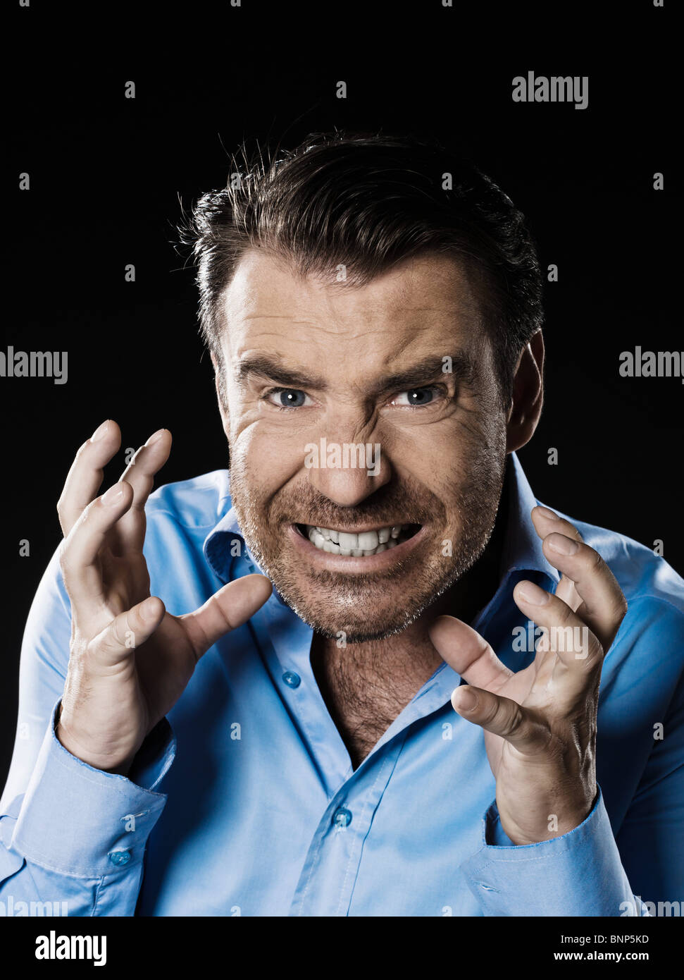 caucasian man unshaven anger portrait isolated studio on black ...