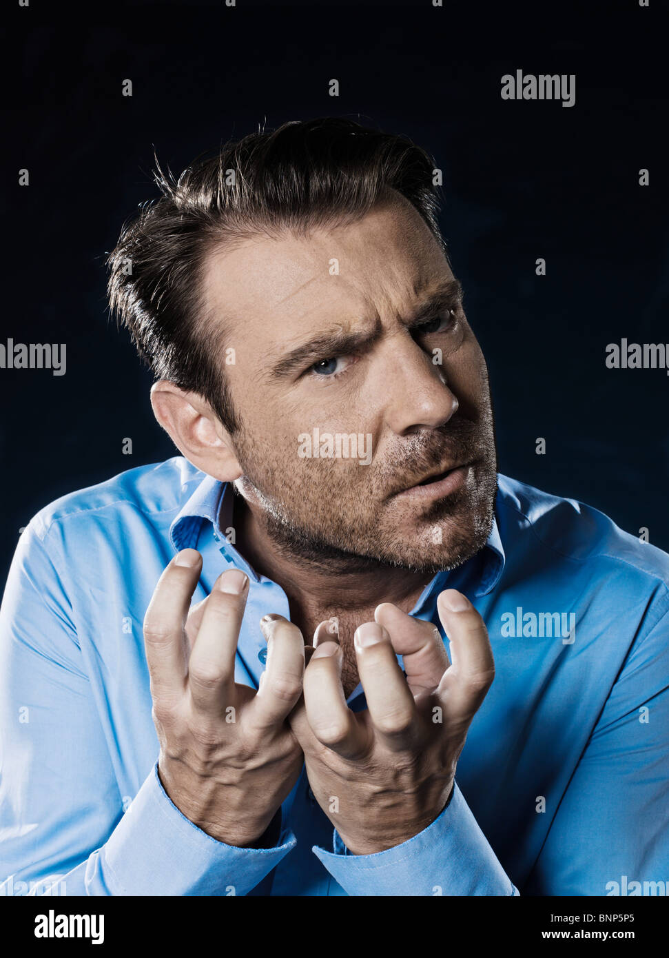 caucasian man unshaven angry portrait isolated studio on black ...
