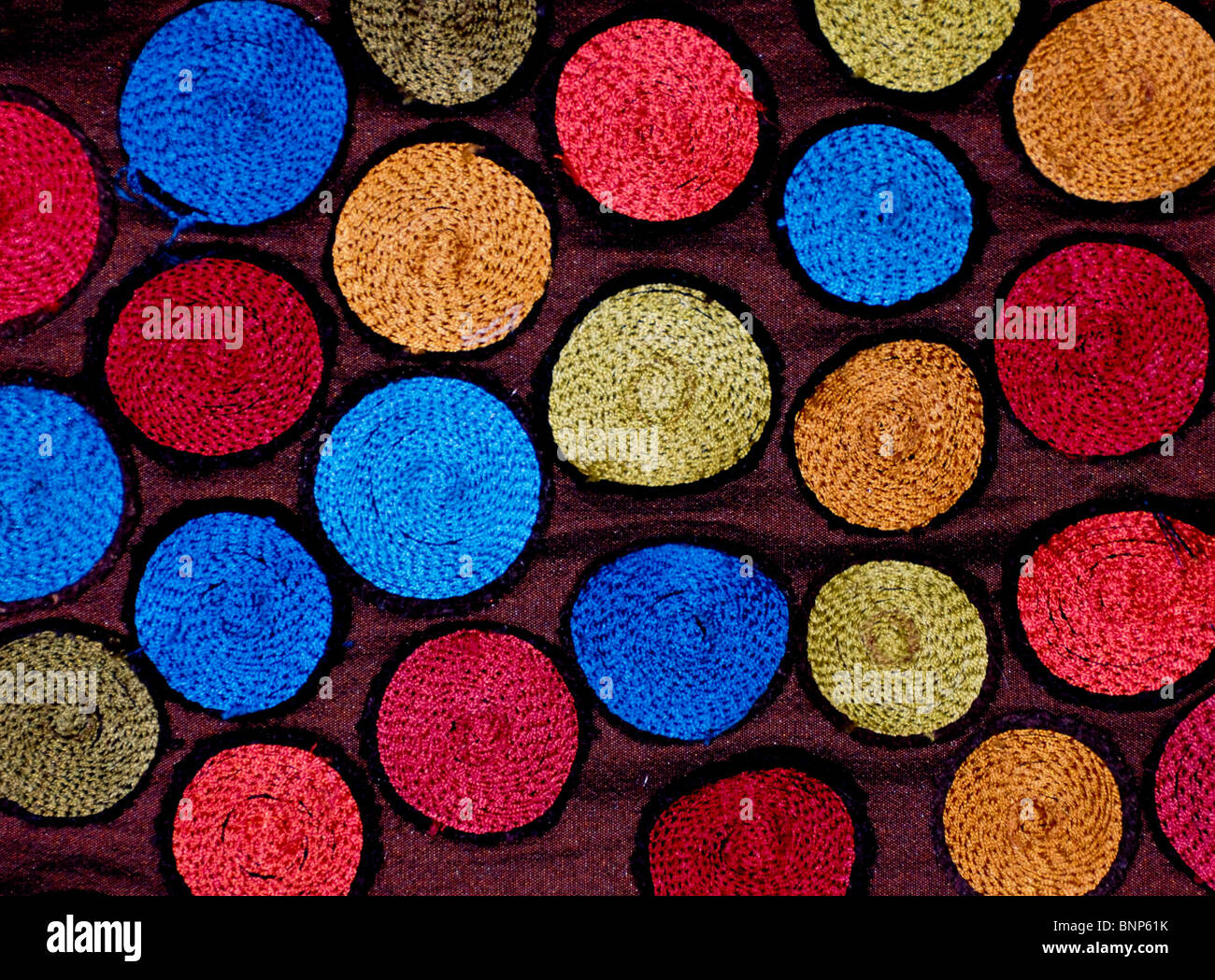 A pattern of colorful, embroidered circles Stock Photo - Alamy
