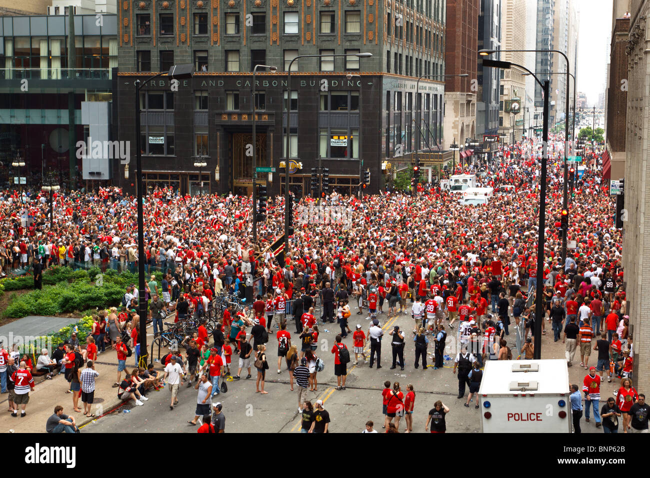 A shot of the crowd gathered on Michigan Avenue in downtown Chicago, IL ...