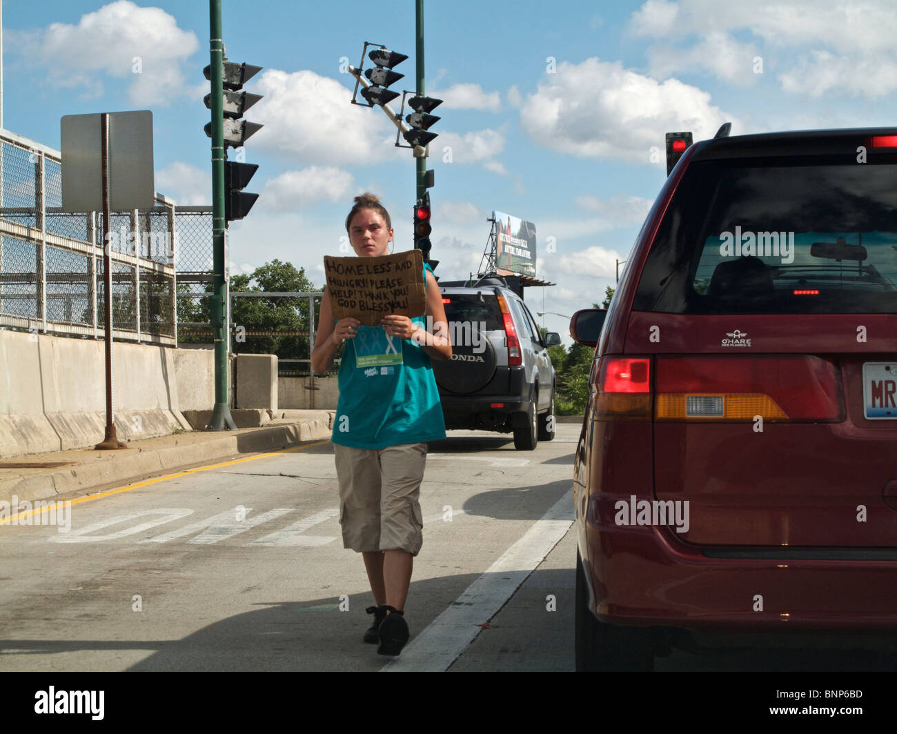 Woman panhandling on Edens expressway off ramp at Wilson Avenue ...