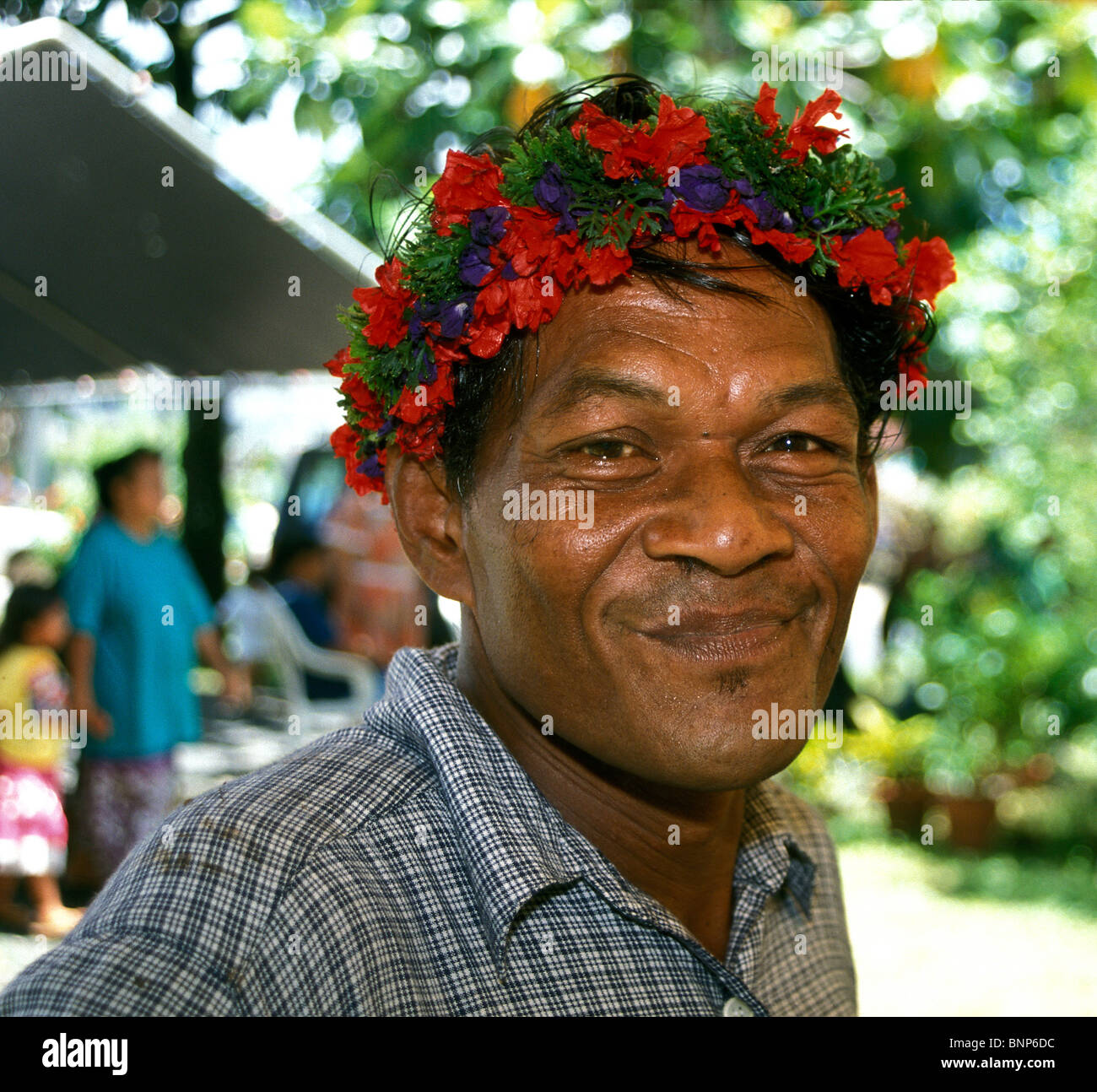 Micronesian man wears a garland of local flowers on Pohnpei (Ponape ...