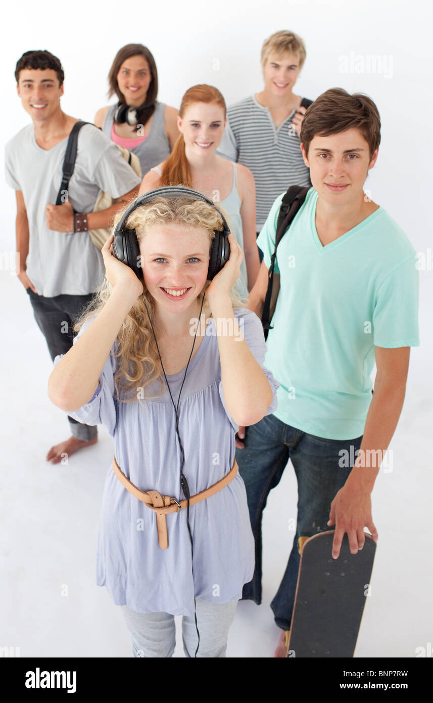 Happy teenagers smiling at the camera Stock Photo - Alamy