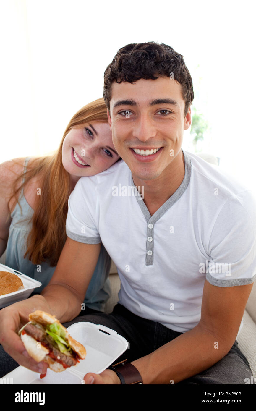Teenagers eating burgers and fries Stock Photo - Alamy