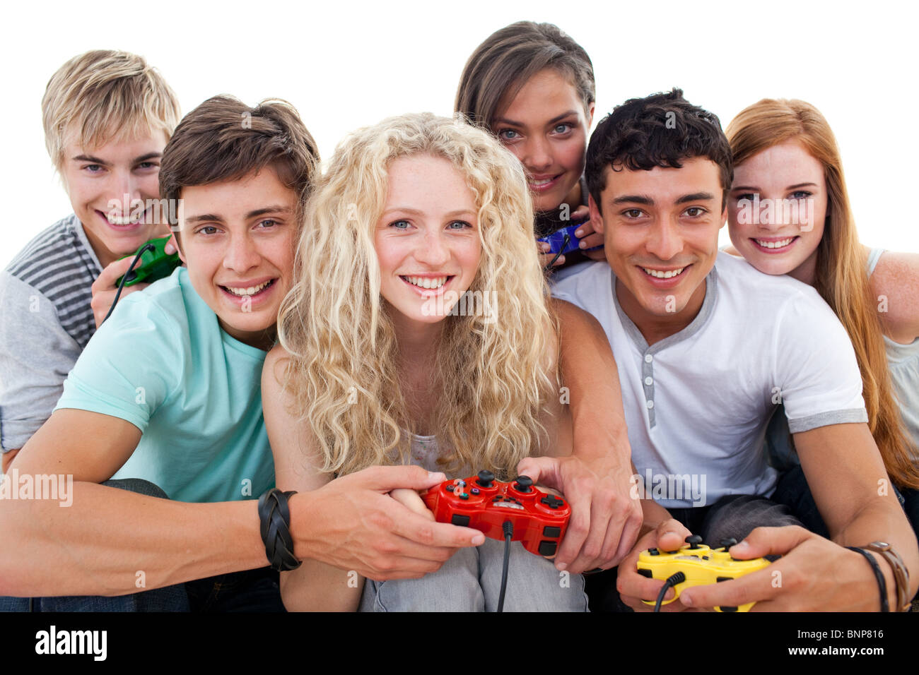 Portrait of teenagers playing video games in the living-room Stock ...